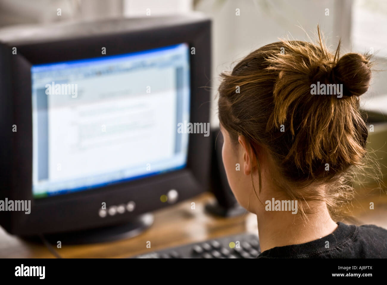 Girl surfing the internet on a personal computer Stock Photo - Alamy