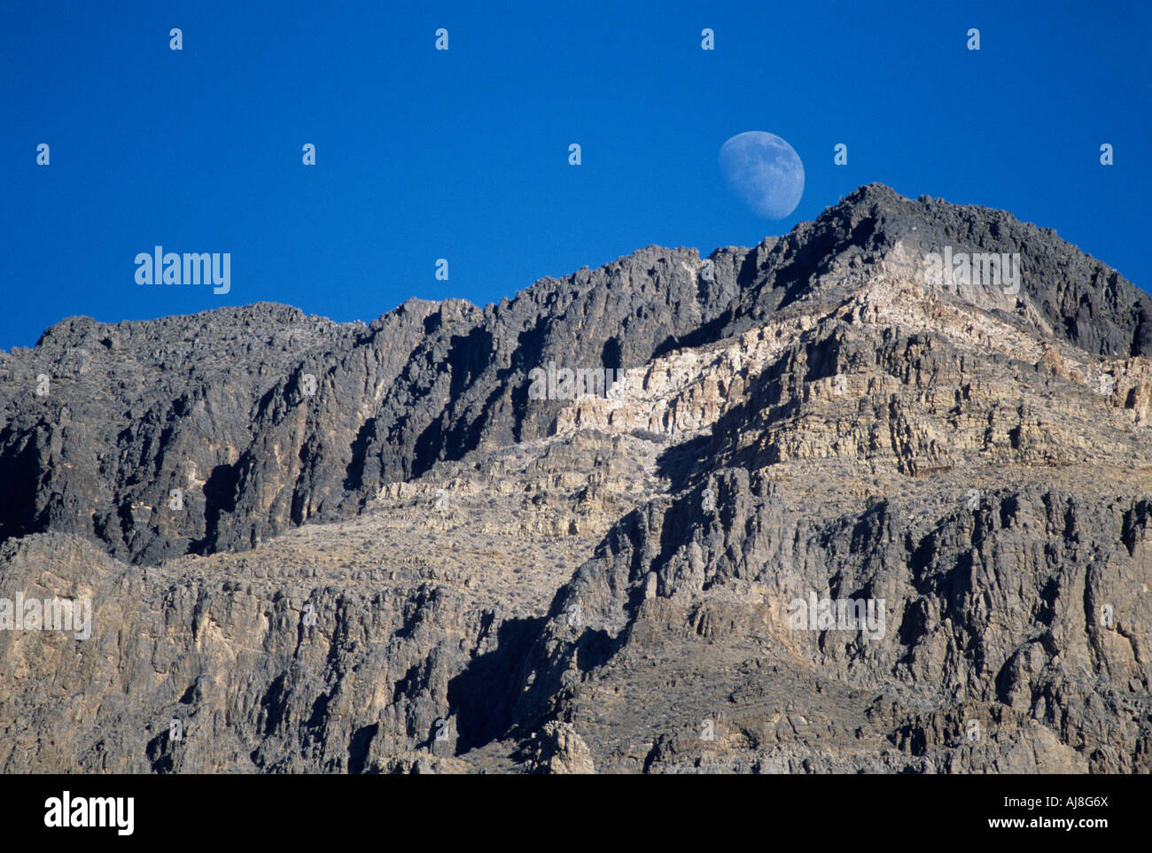 USA Nevada Gibbous moon rises over desert mountains east of Las Vegas ...