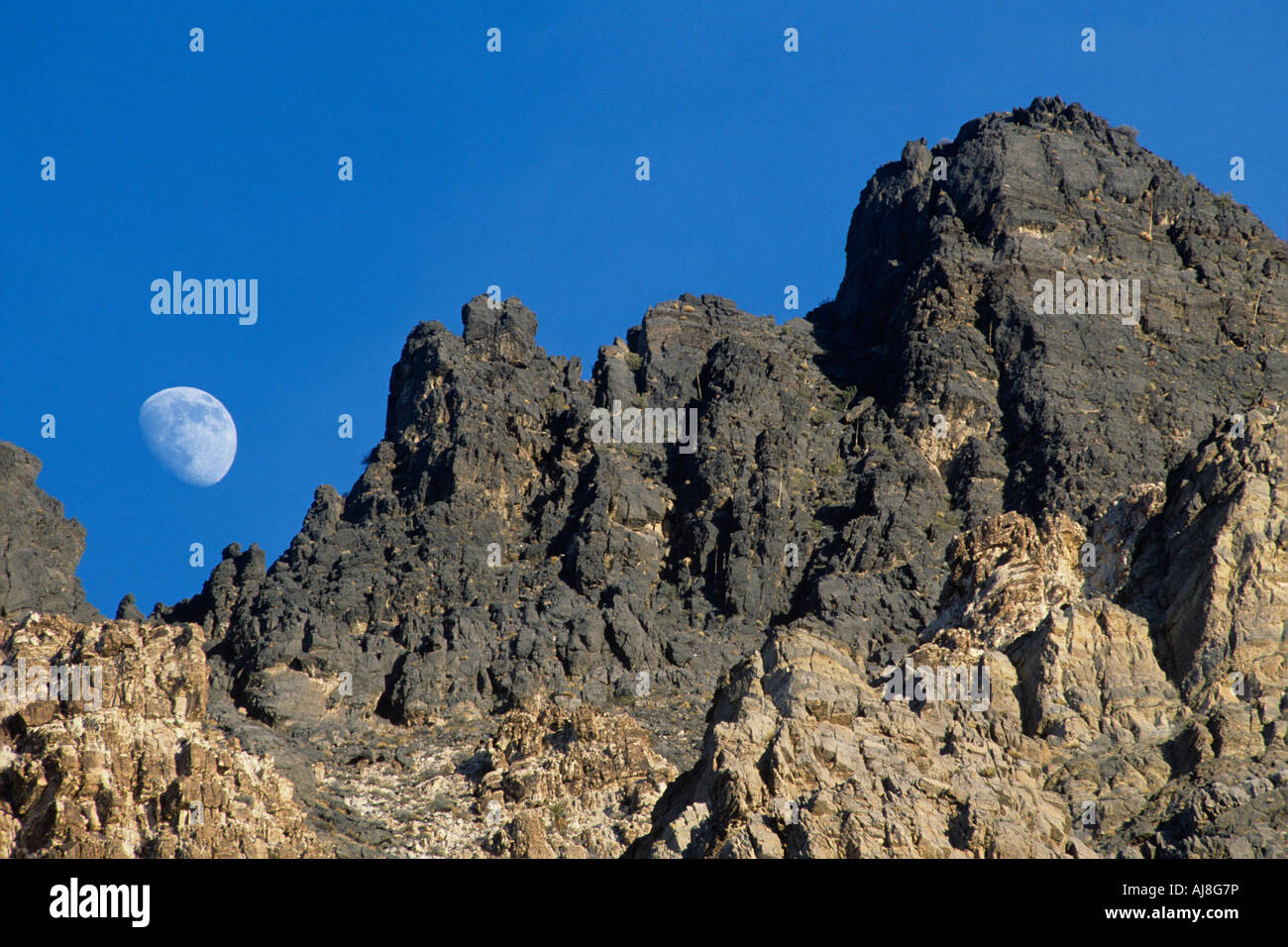USA Nevada Gibbous moon rises over desert mountains east of Las Vegas ...