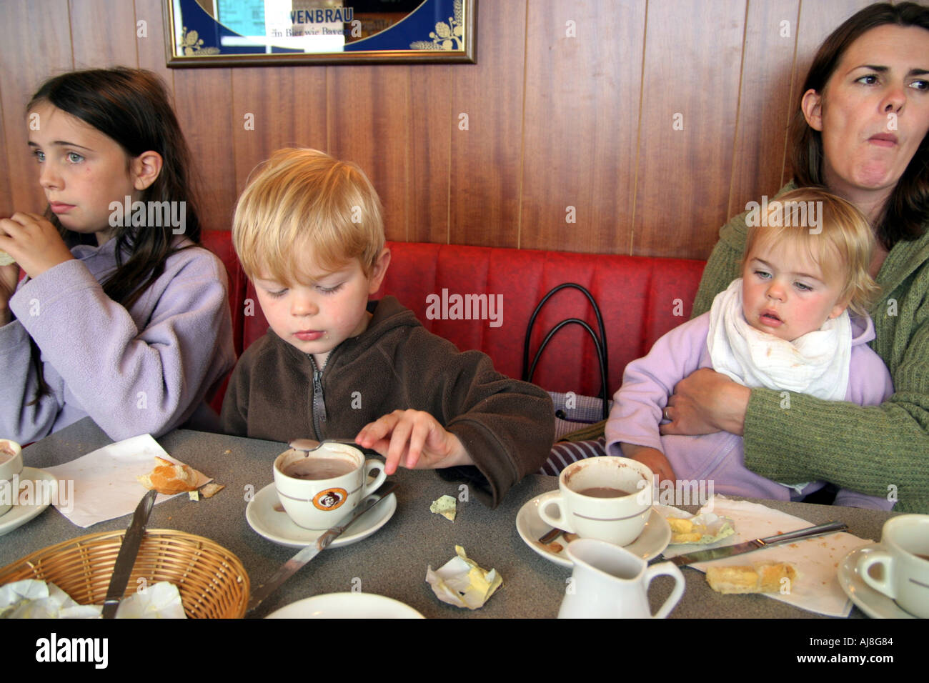 Children eating chocolate bar hi-res stock photography and images - Alamy