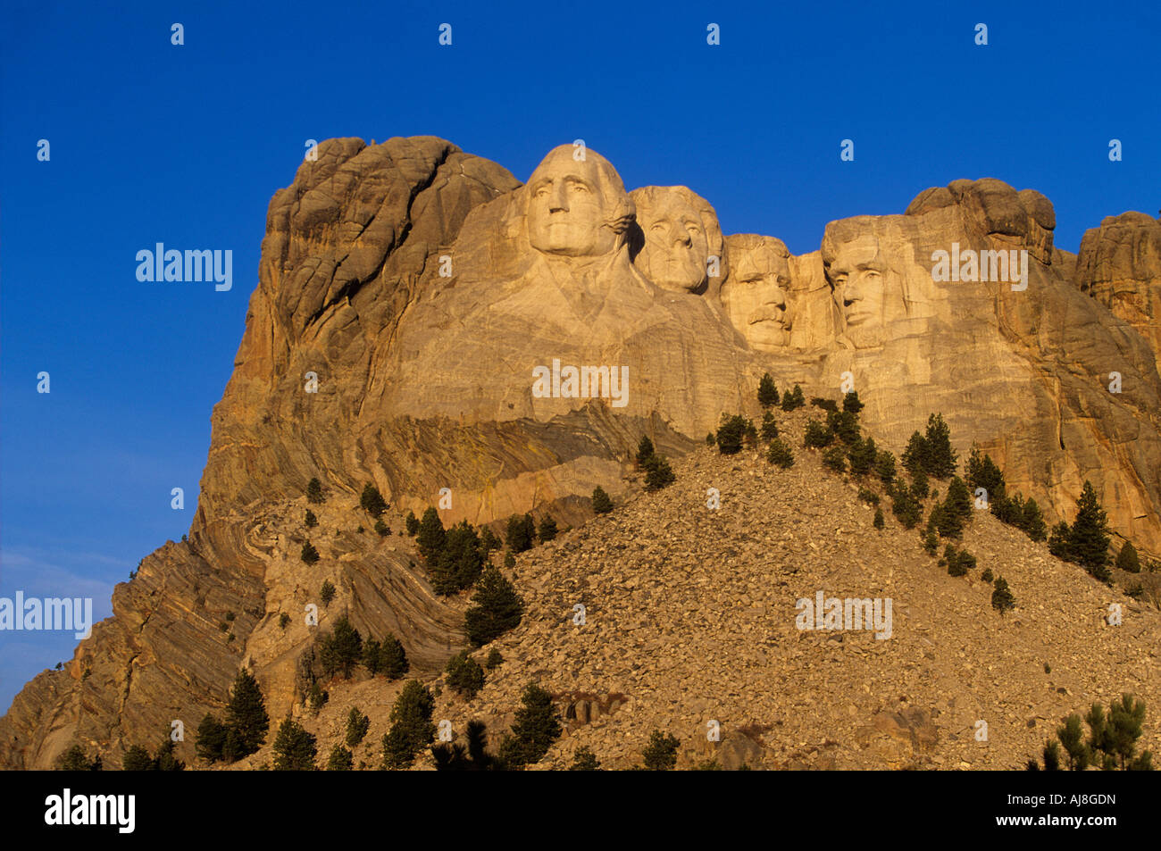 USA South Dakota Winter morning sun lights Mount Rushmore National ...
