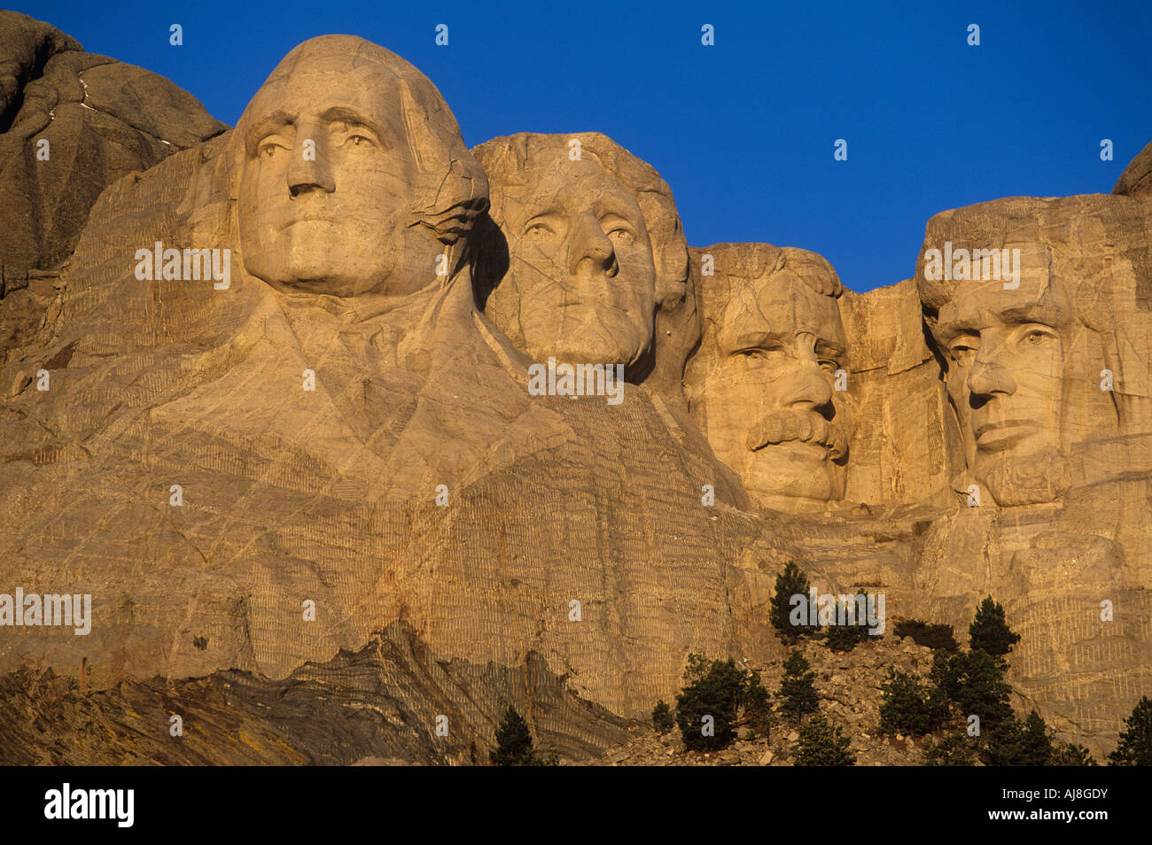 USA South Dakota Winter morning sun lights Mount Rushmore National ...