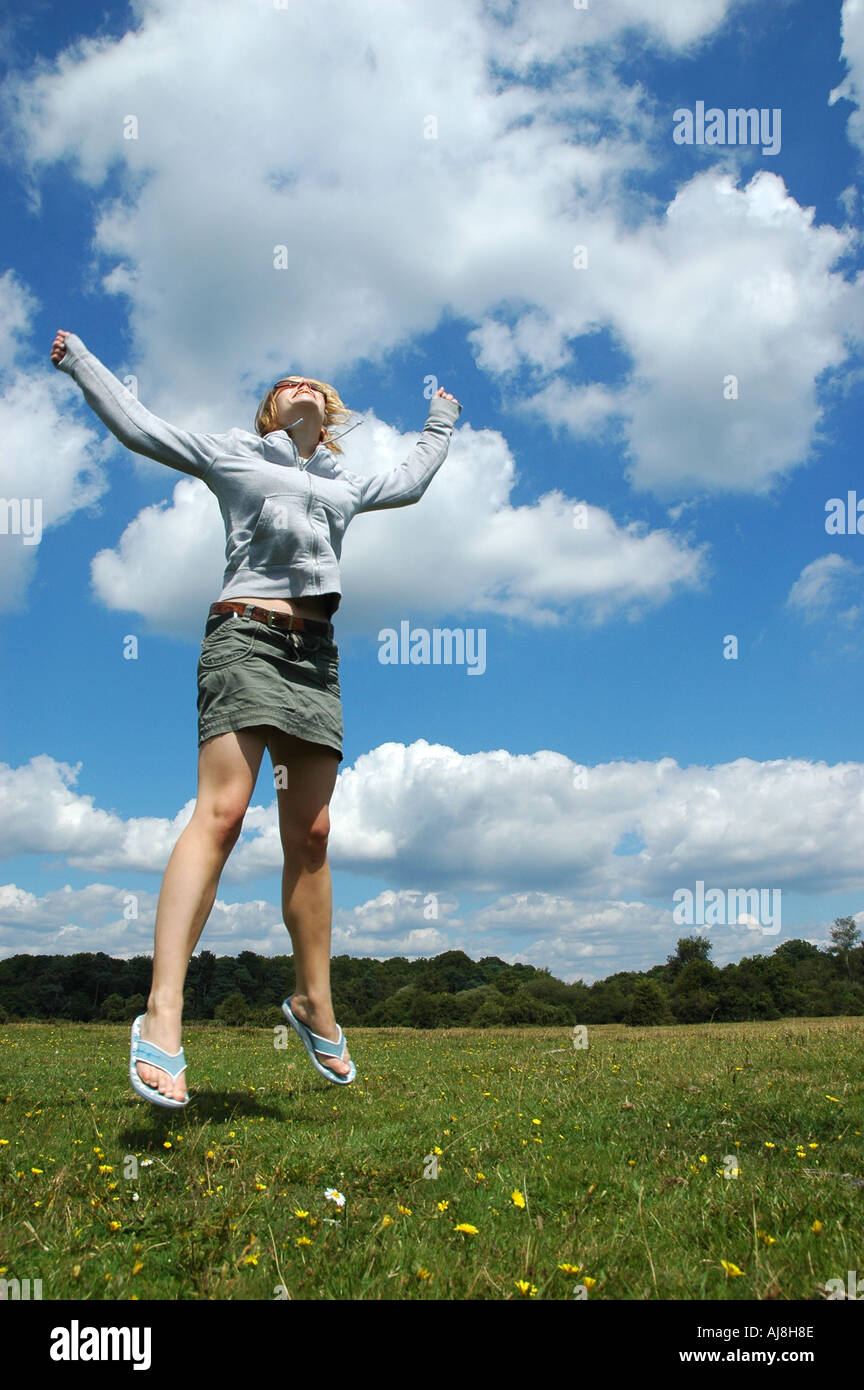Girl star jumping Stock Photo - Alamy