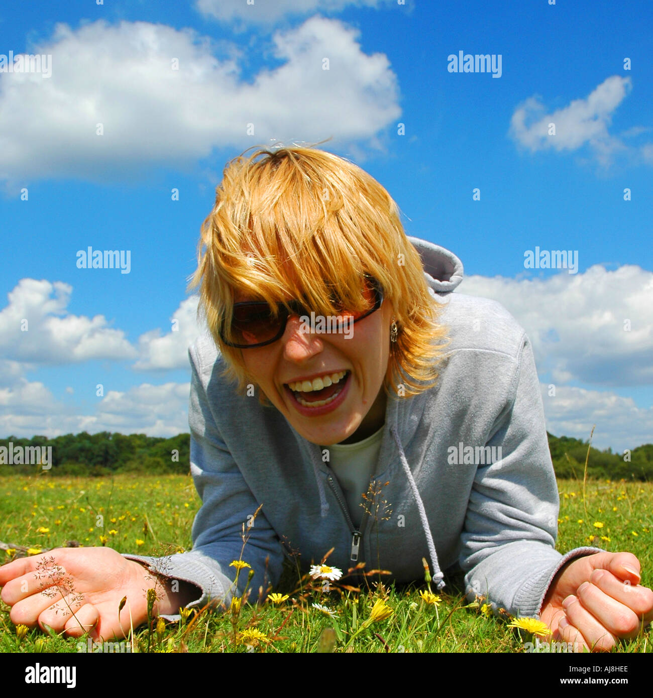 Female lying on grass hi-res stock photography and images - Alamy