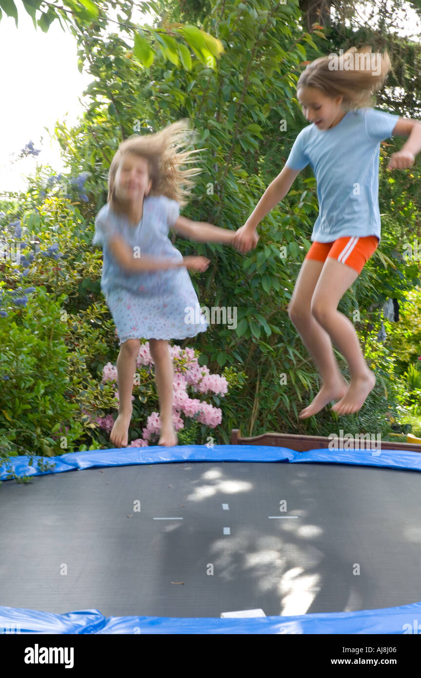 children bouncing on trampoline Stock Photo - Alamy