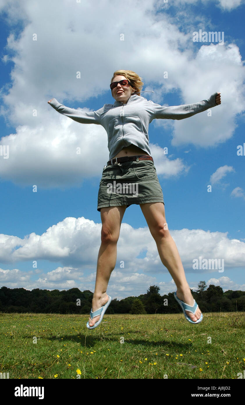 Girl star jumping Stock Photo - Alamy