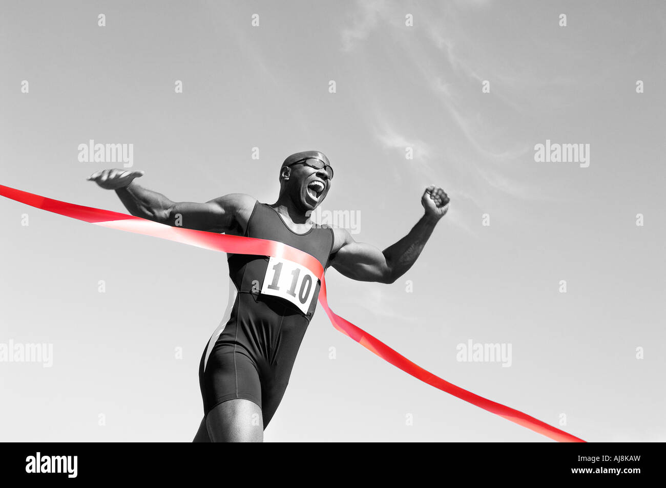 Runner Crossing Finish Line Stock Photo - Alamy