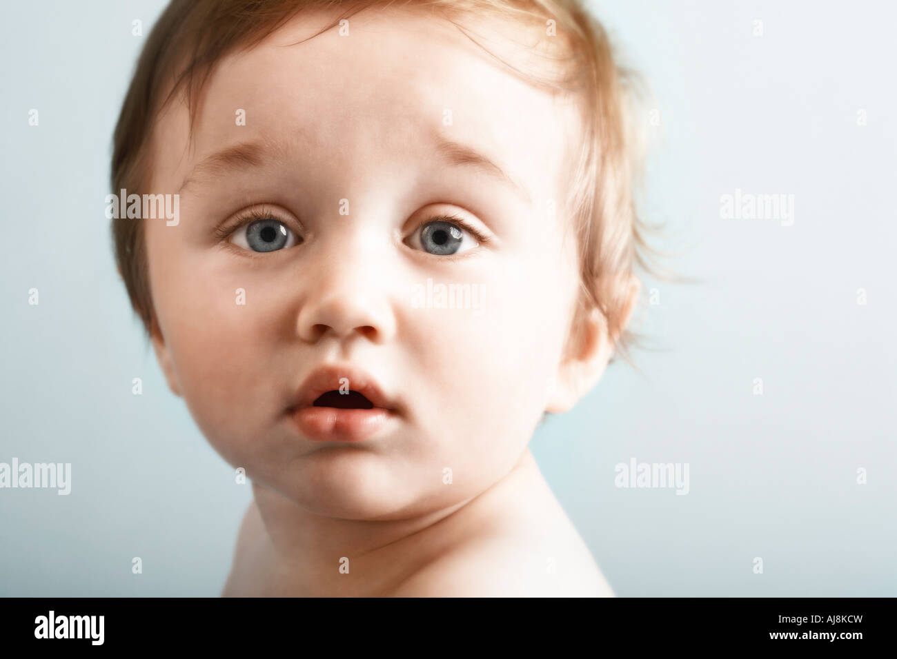 Baby looking at camera Stock Photo - Alamy