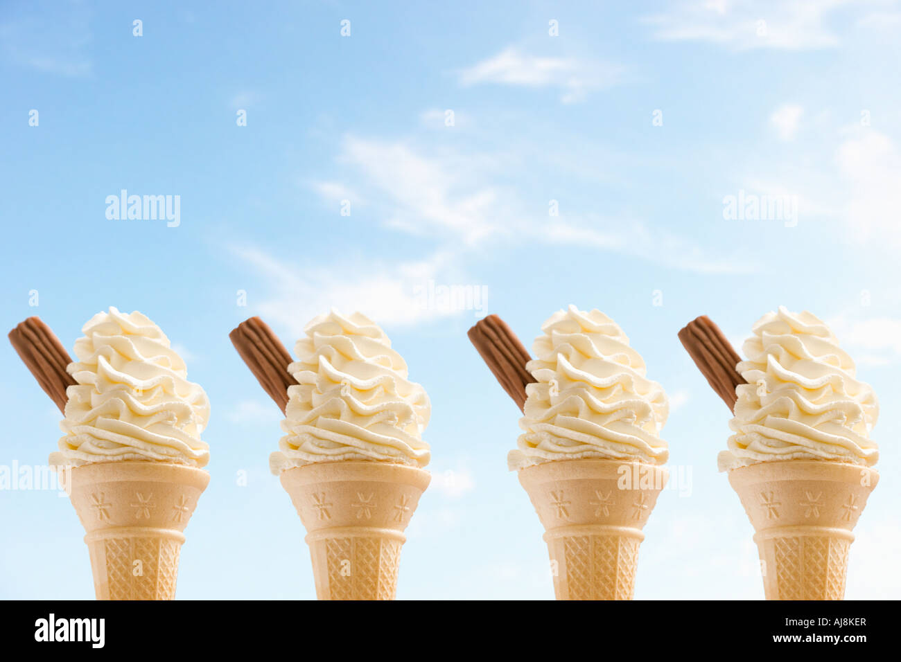 Row of four icecreams against sky Stock Photo - Alamy