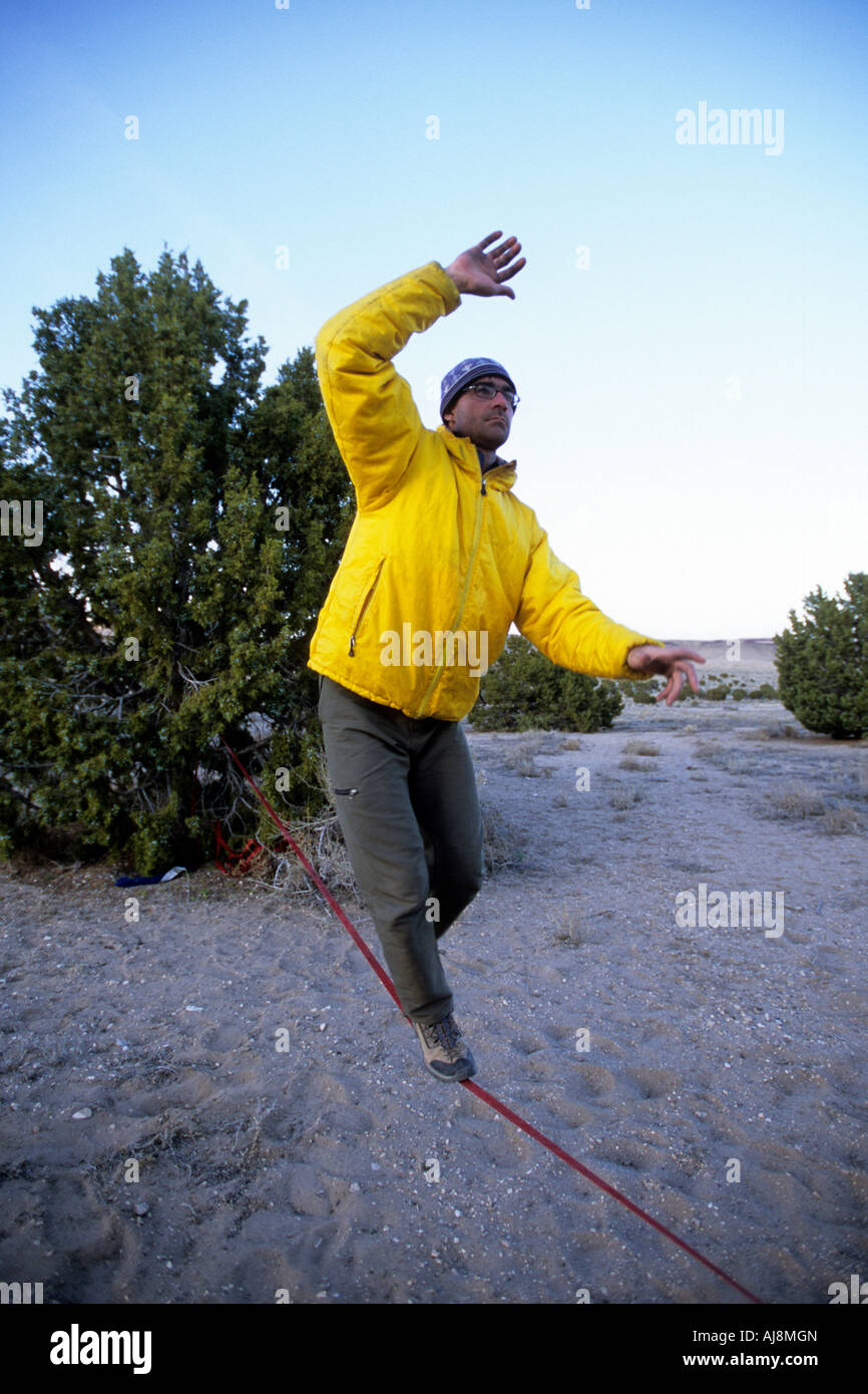 Man walking slack line, Utah Stock Photo - Alamy