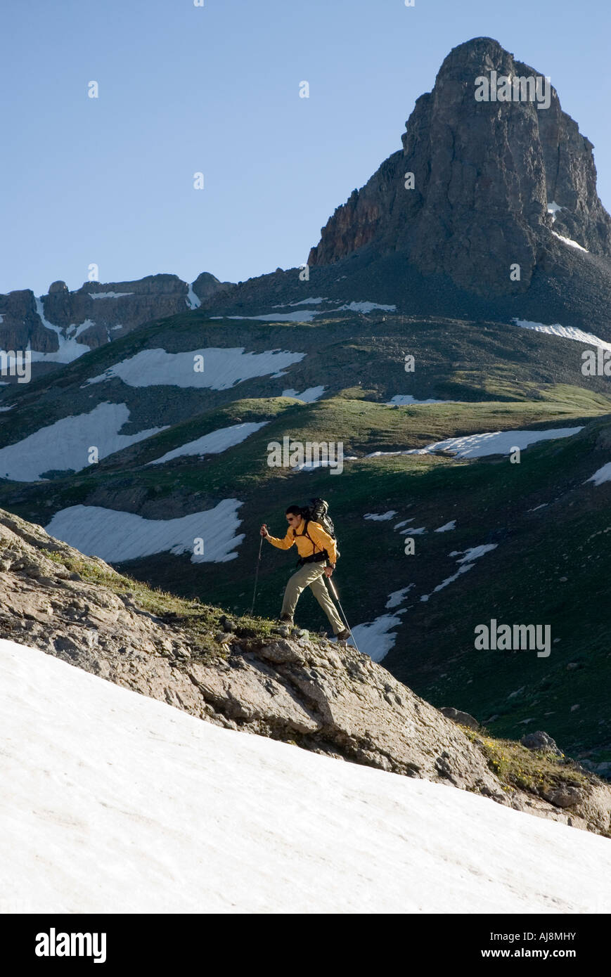 Man hikes in Ice Lakes Basin Stock Photo - Alamy
