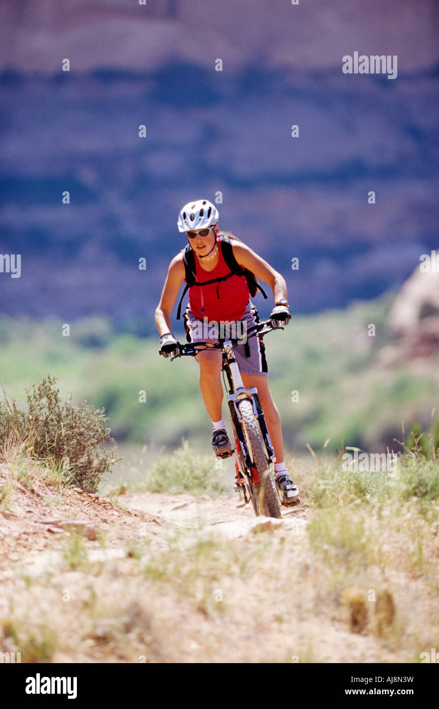 Woman mountain biking in Moab, Utah Stock Photo - Alamy