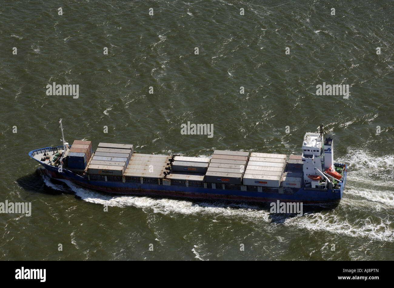Aerial view of a container ship on the North sea off the Dutch coast ...