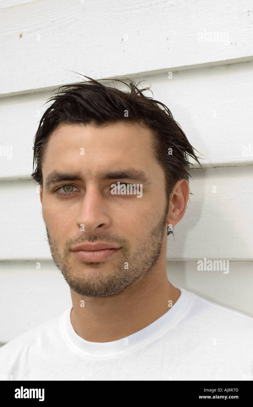 portrait of a handsome man looking at the camera Stock Photo - Alamy