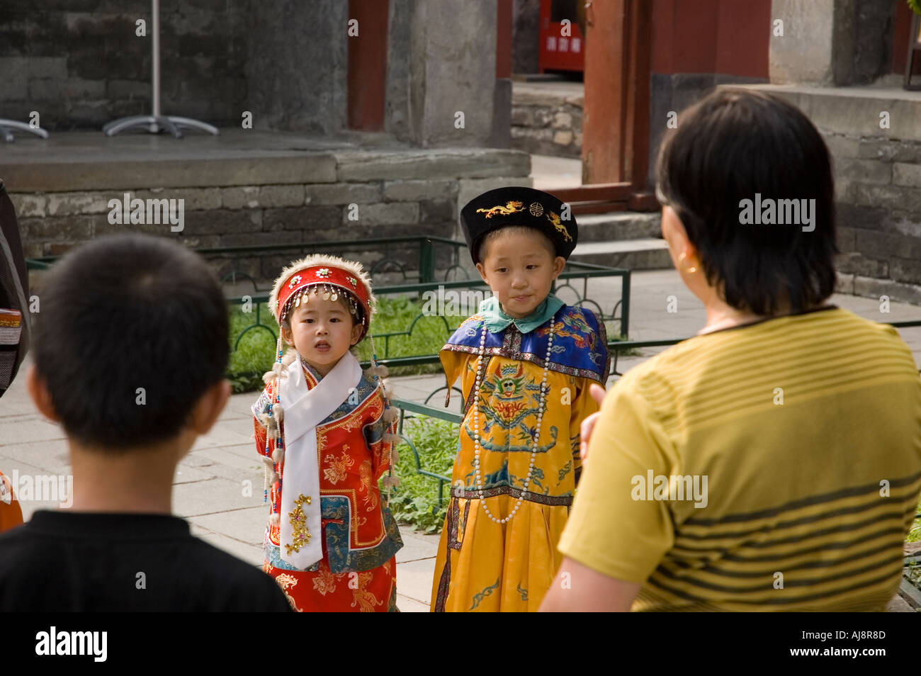 Chinese children wearing traditional costumes Stock Photo - Alamy