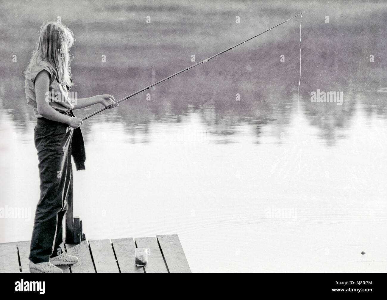 Girl with fishing rod Stock Photo - Alamy