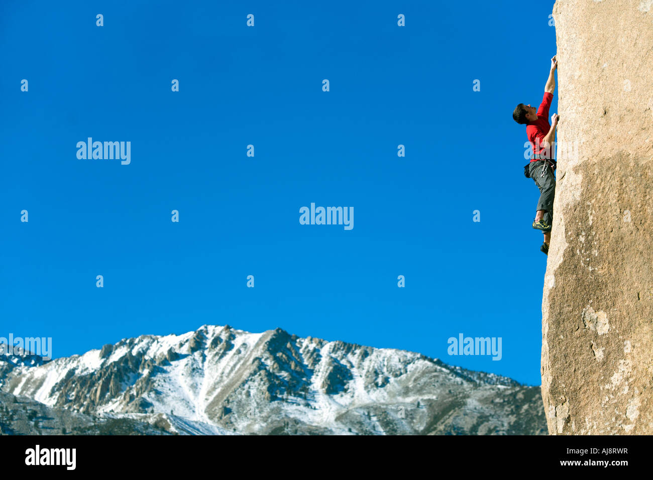 Man lead climbing Stock Photo - Alamy