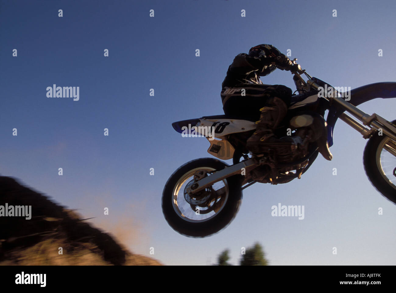 Motor-cross bike jumping in air Stock Photo - Alamy