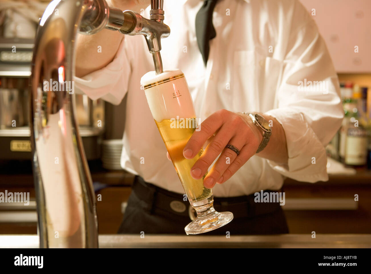 Bartender pouring a beer Stock Photo - Alamy