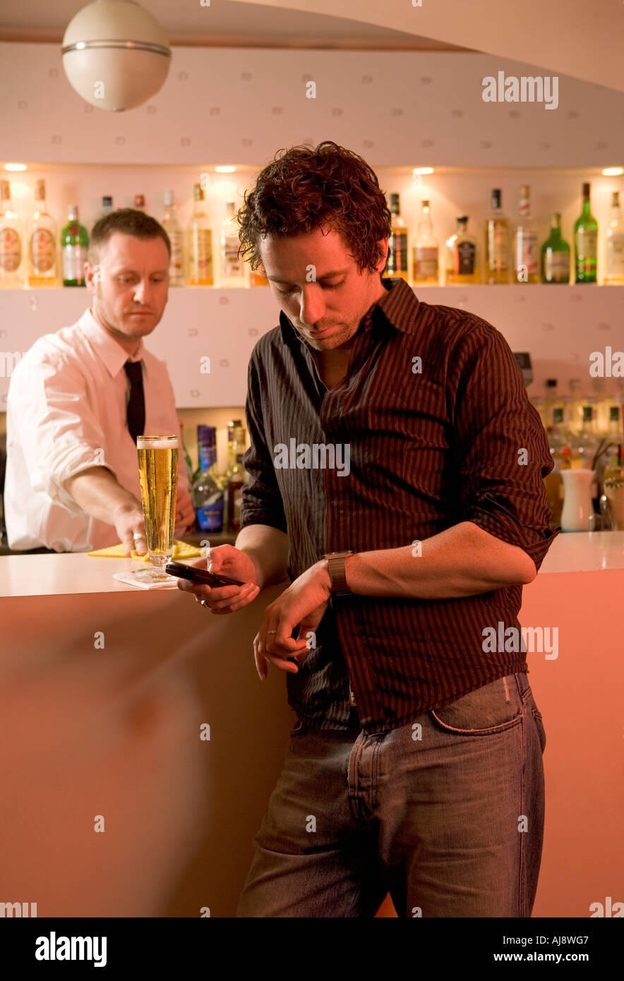 Man stood at bar hi-res stock photography and images - Alamy