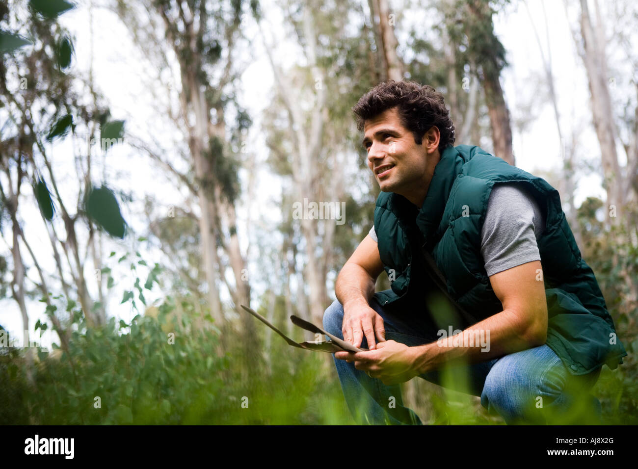 Outdoor rugged guy in the forest Stock Photo - Alamy