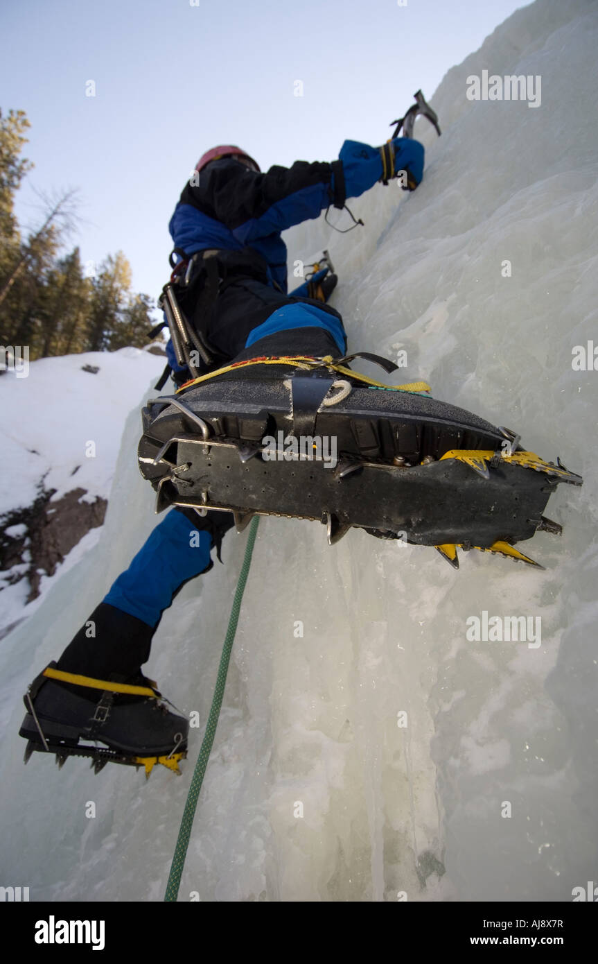 Man ice climbing Stock Photo - Alamy