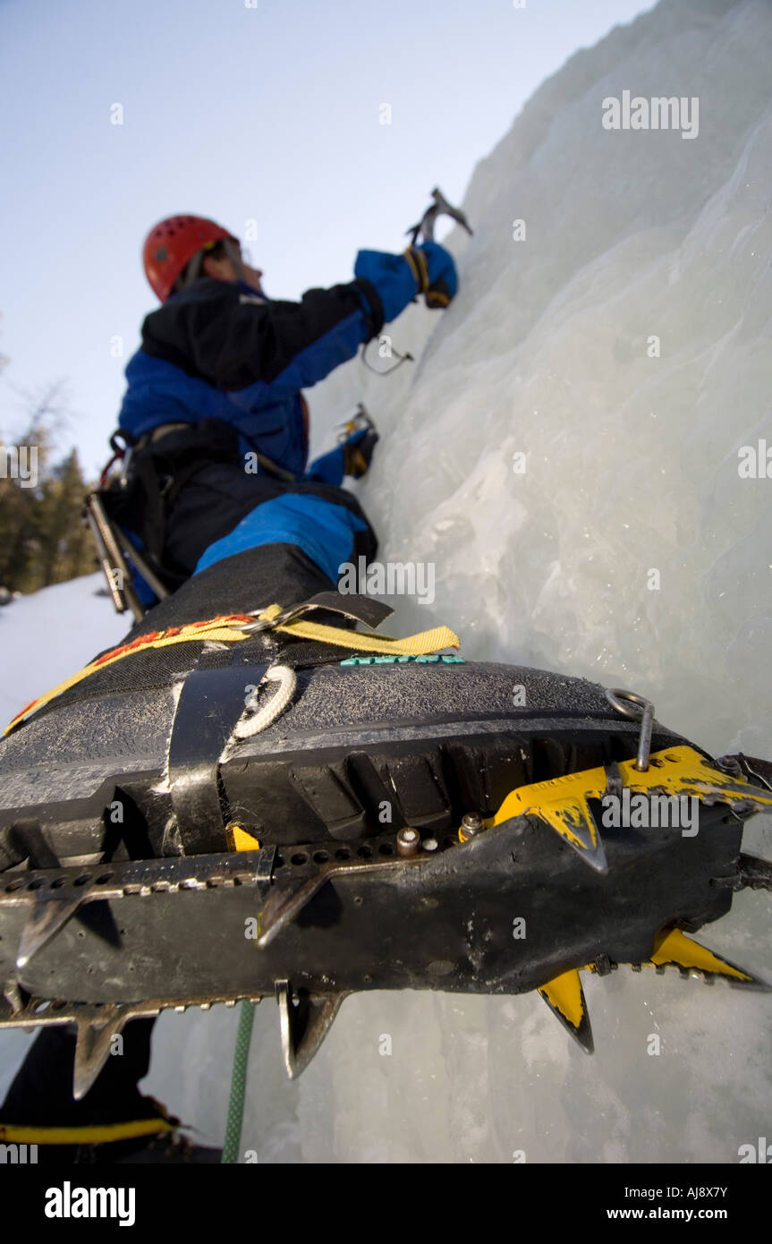 Man ice climbing Stock Photo - Alamy