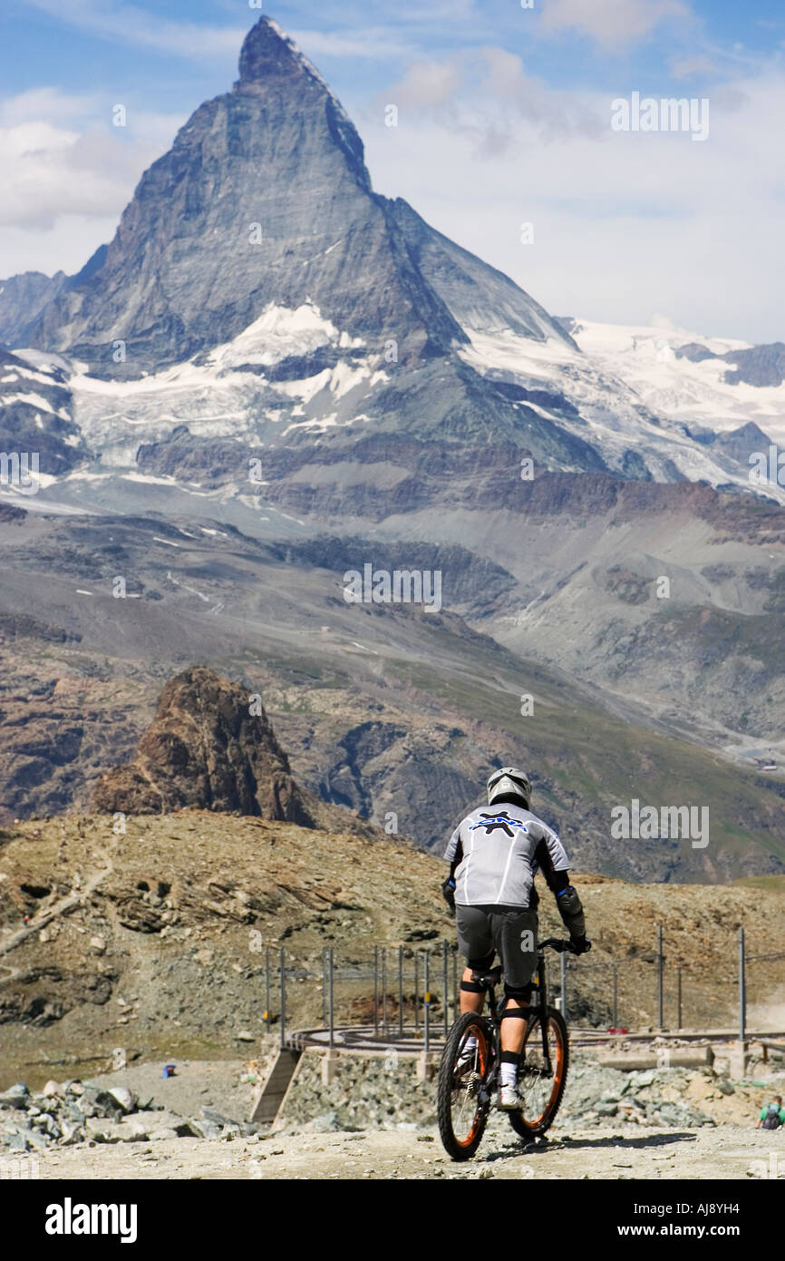 Mountain biker starts a decent from the Gornergrat summit station near ...
