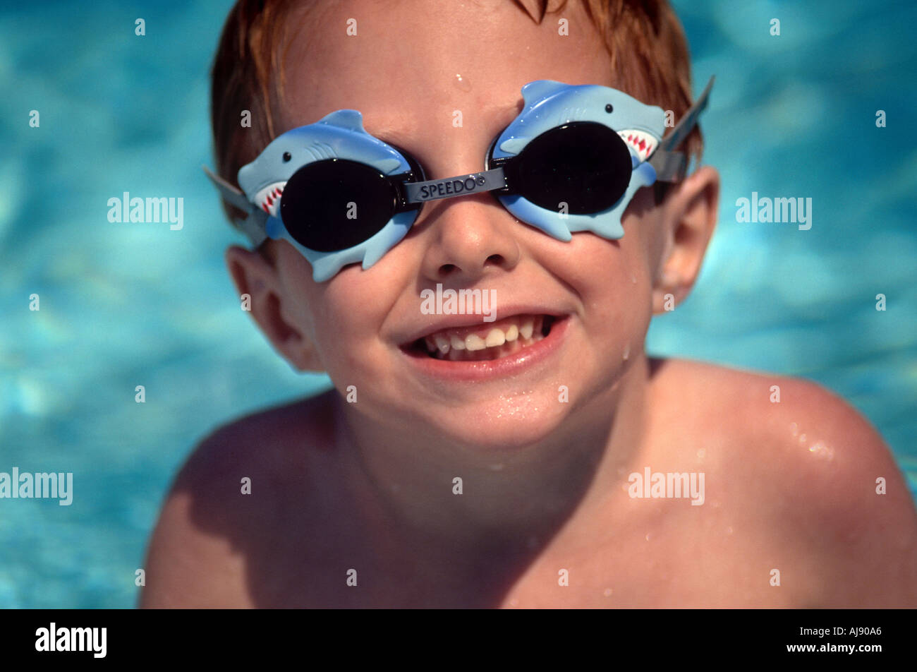3 Year Old Boy Real Learning To Swim And Having Fun In Pool With Shark 3-year-old-boy-real-learning-to-swim-and-having-fun-in-pool-with-shark