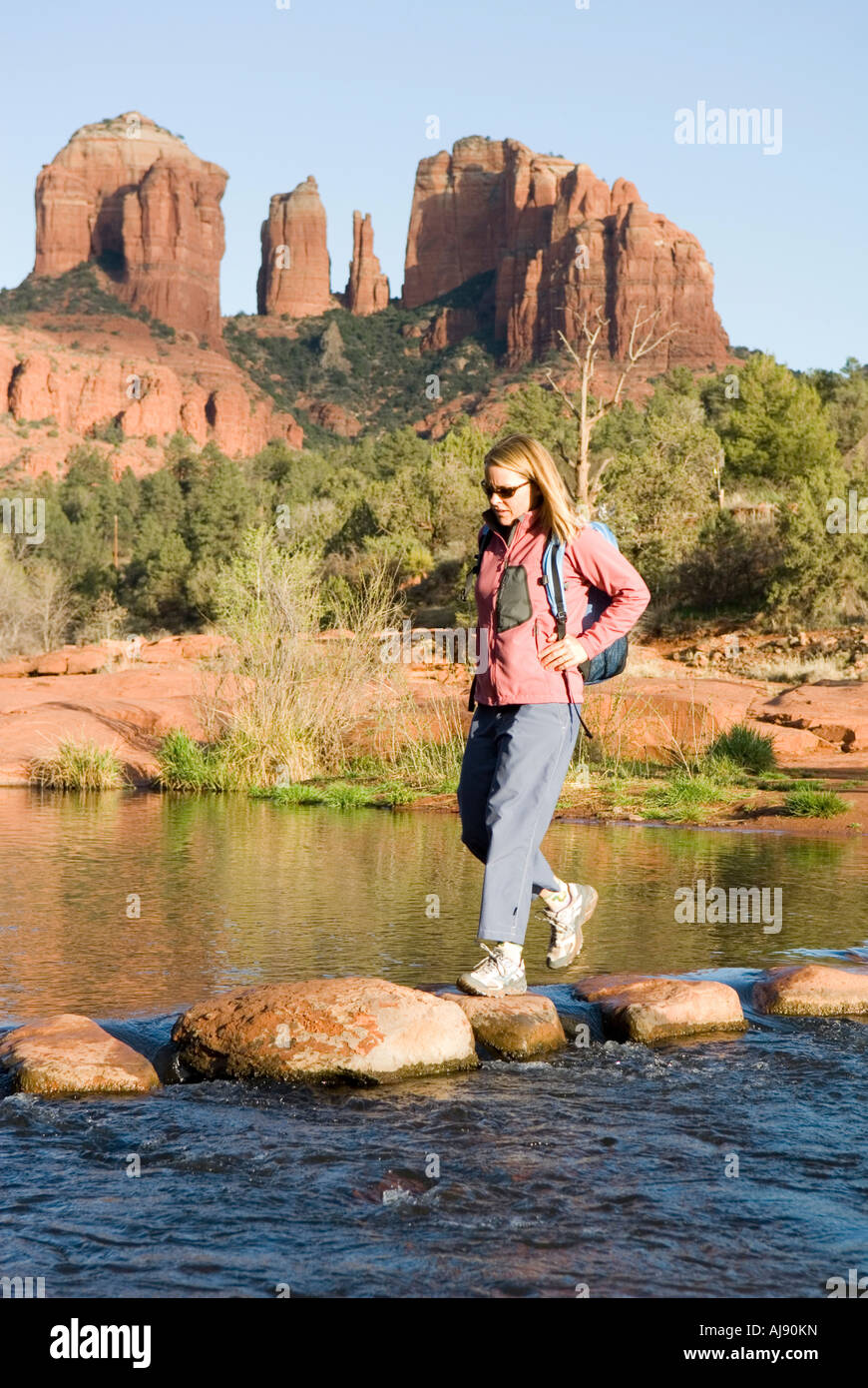 Woman walking across stone hi-res stock photography and images - Alamy