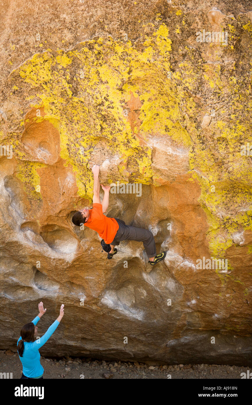 Two climbers bouldering Stock Photo - Alamy