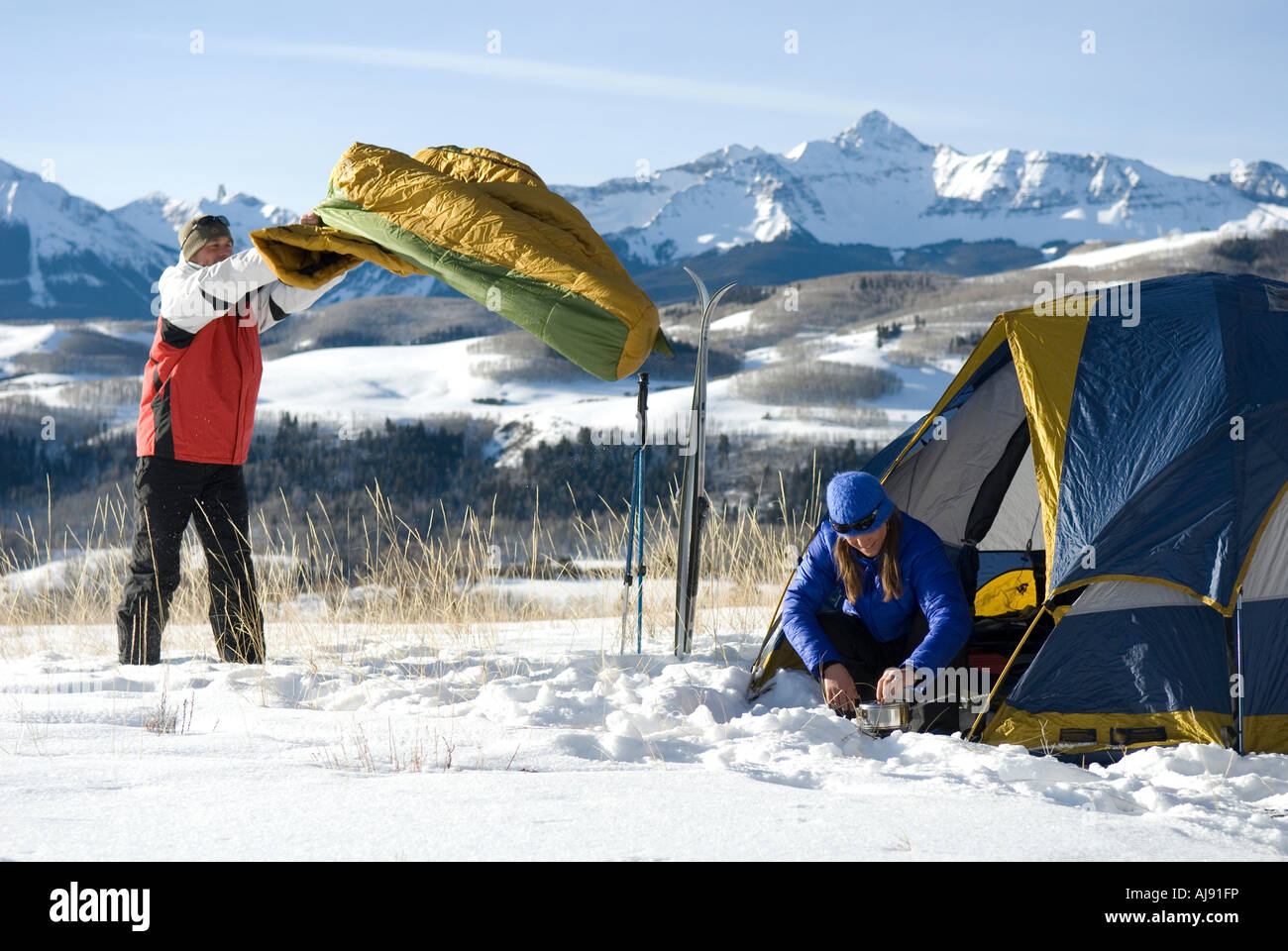 Man boiling water near tent Stock Photo - Alamy