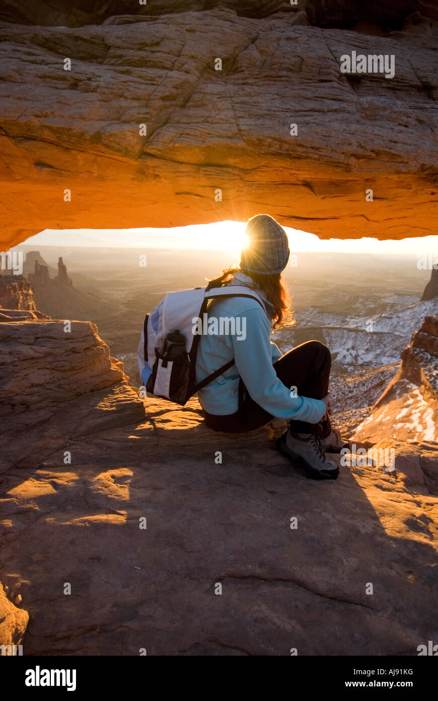 Woman on rock arch hi-res stock photography and images - Alamy