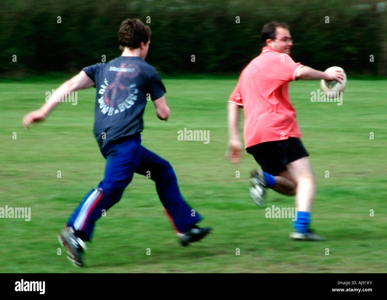 two men playing touch rugby Stock Photo - Alamy