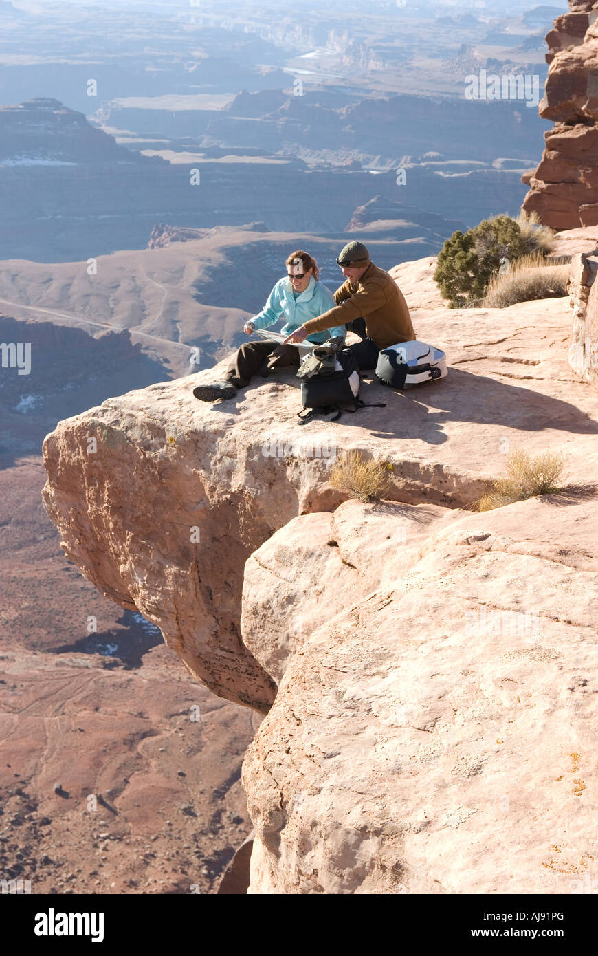 Man and woman reading trail map Stock Photo - Alamy