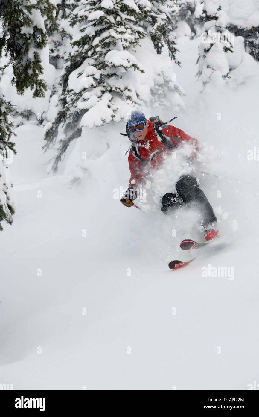 Young man skiing in deep powder Stock Photo - Alamy