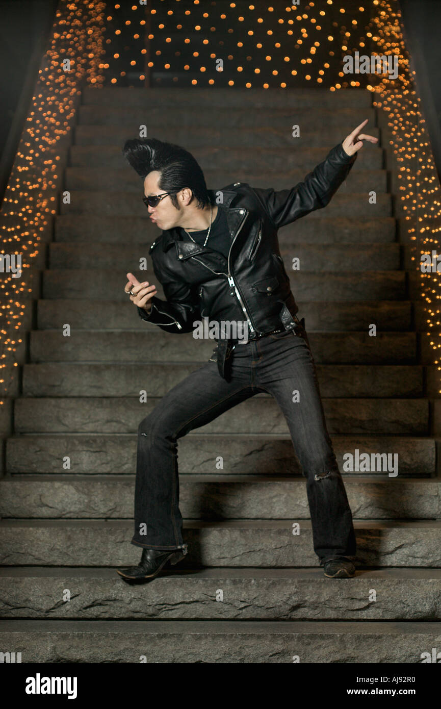 Man imitating rock and roll singer Tokyo Japan Stock Photo - Alamy