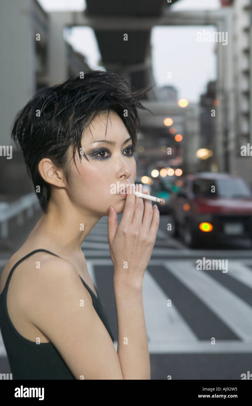 Japanese woman smoking cigarette tokyo hi-res stock photography and ...
