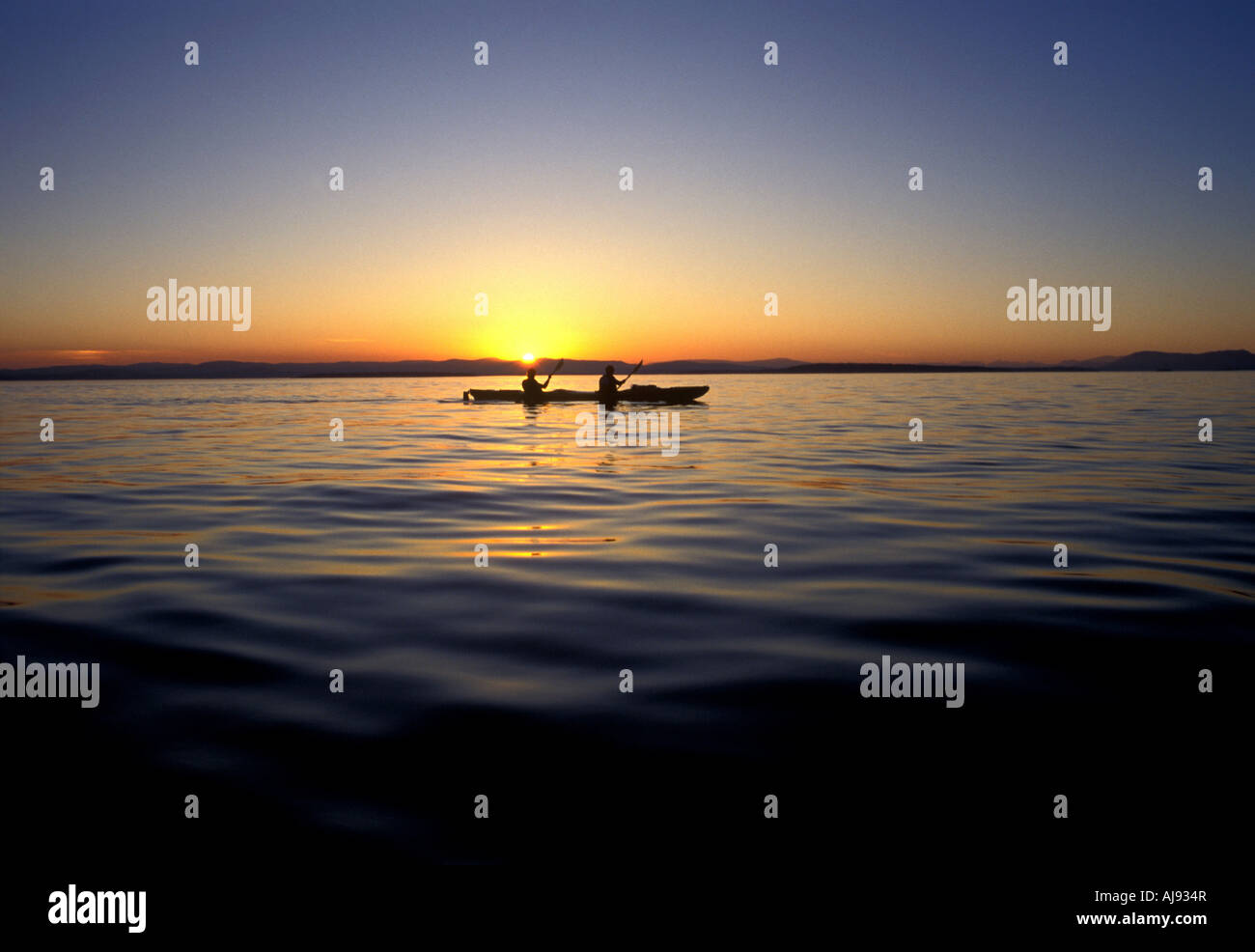 Tandem sea kayaking Stock Photo - Alamy
