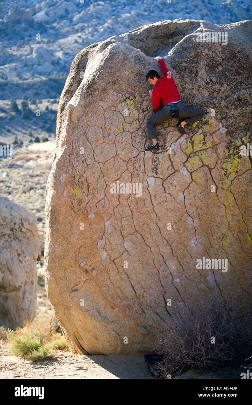 Man bouldering on a boulder Stock Photo - Alamy