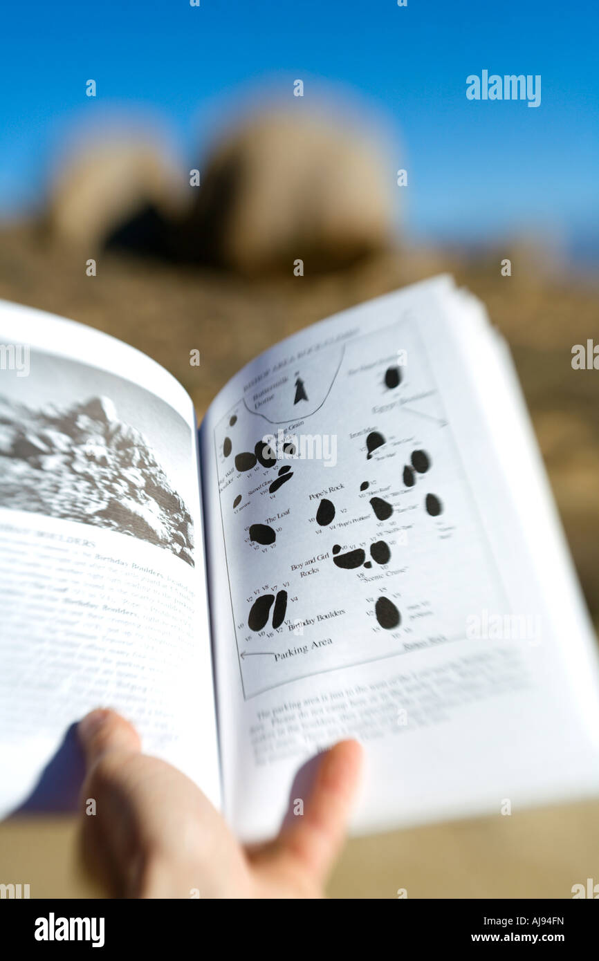 Holding a bouldering guidebook Stock Photo - Alamy