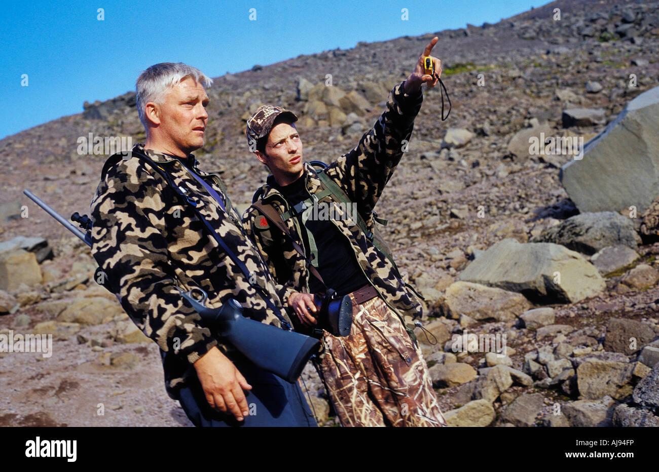 Two reindeer hunters in Iceland Stock Photo - Alamy