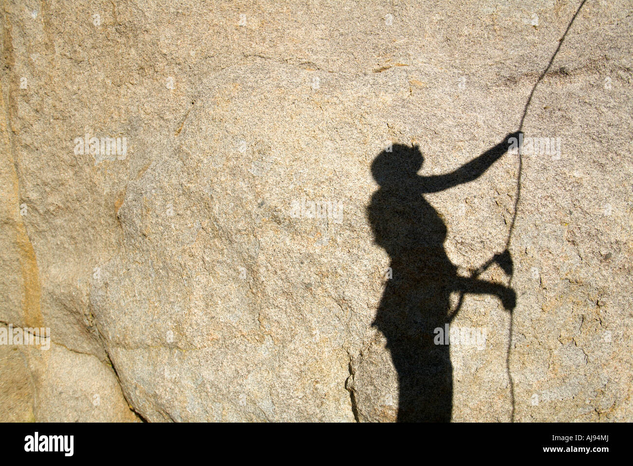 Shadow on rock of woman belaying Stock Photo - Alamy