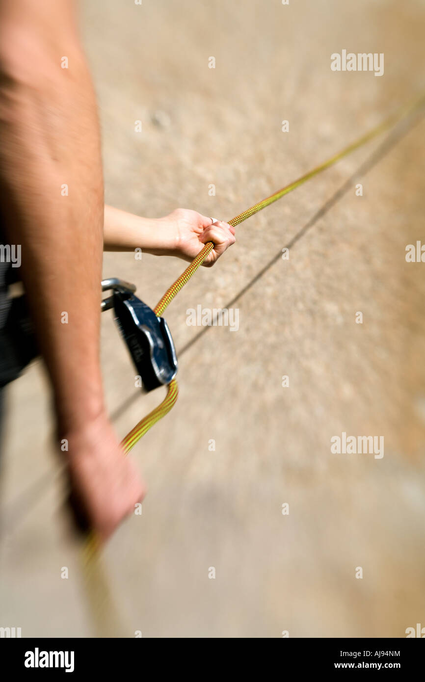 Hands on rope while belaying Stock Photo - Alamy