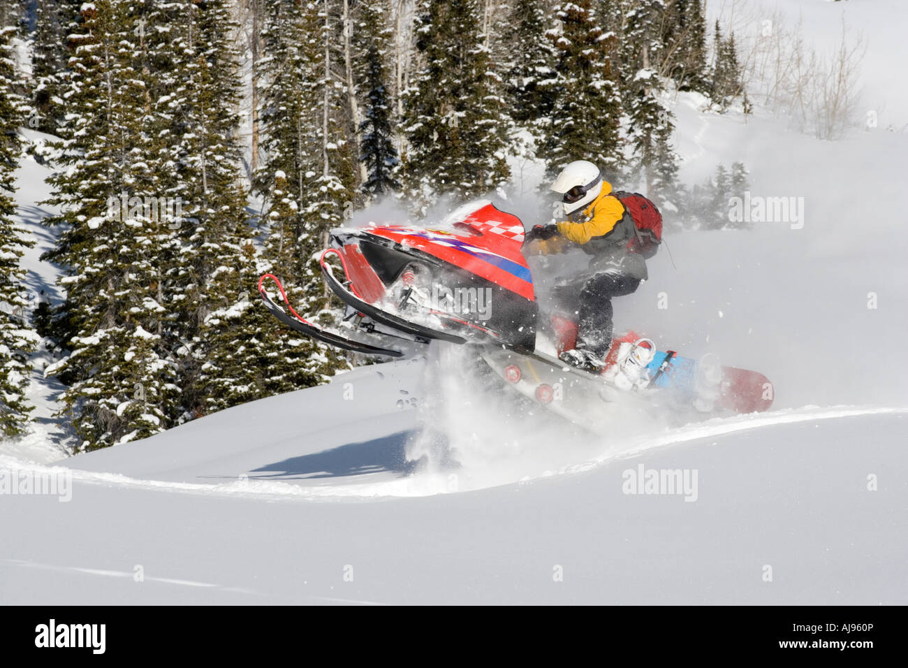 Snowmobiling in the mountains Stock Photo - Alamy