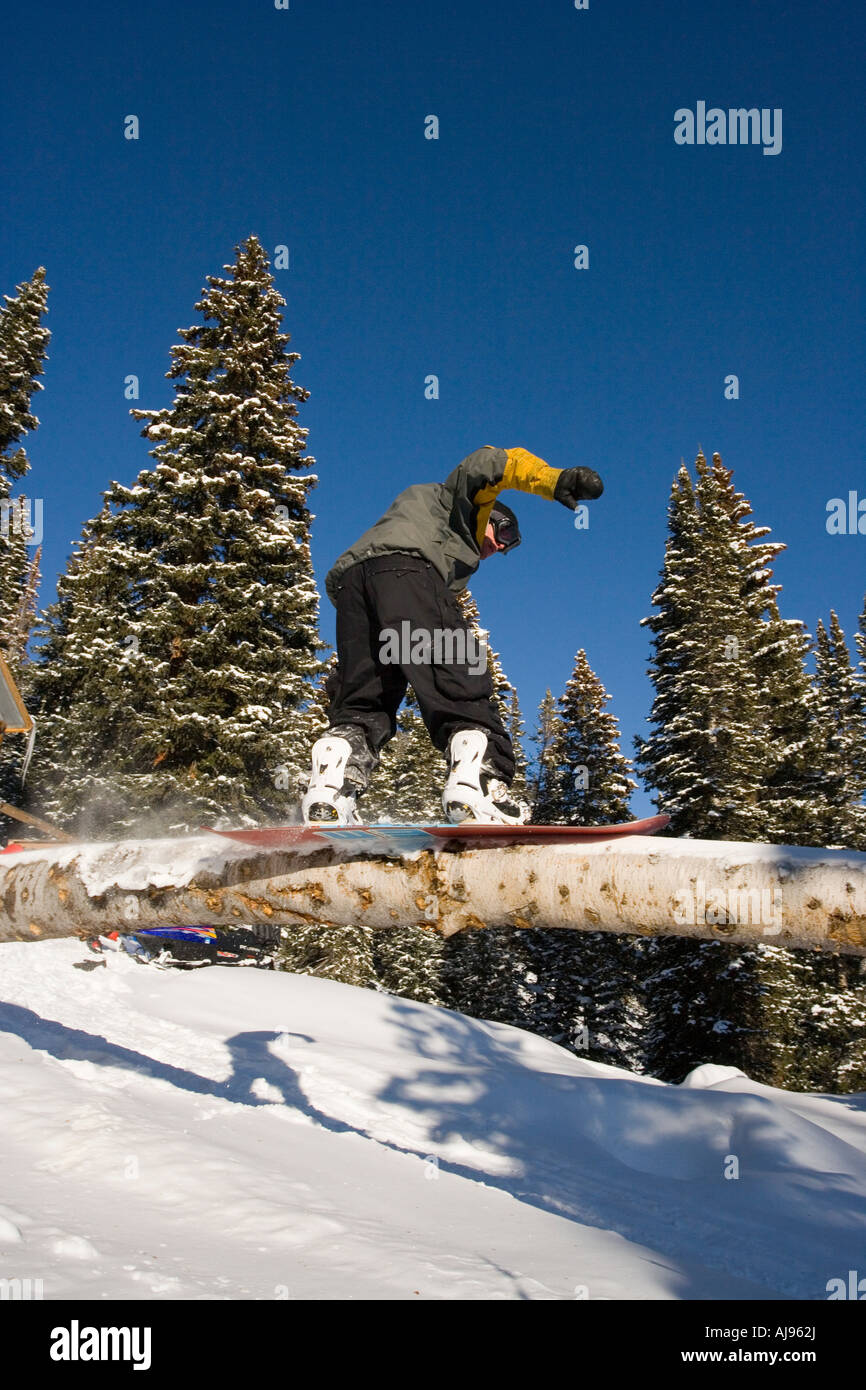 Snowboarding on a rail Stock Photo - Alamy