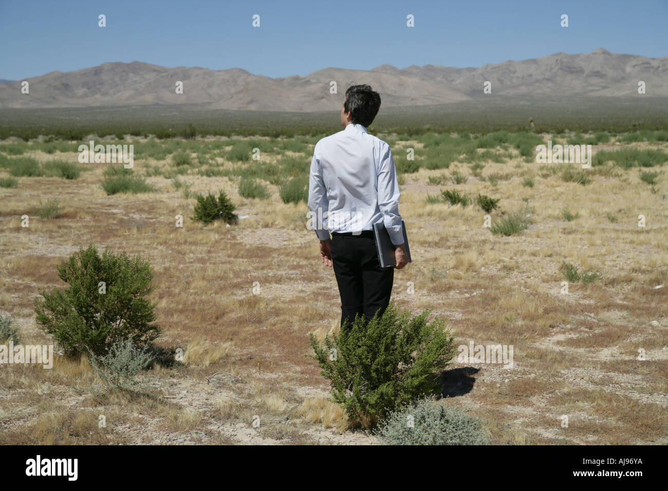 Man holding laptop under arm hi-res stock photography and images - Alamy