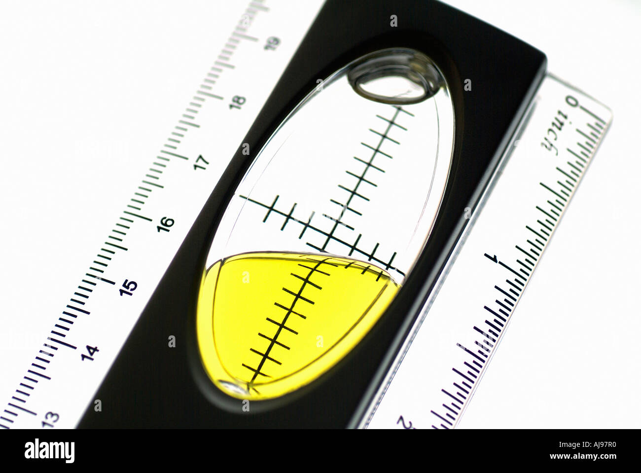 Spirit level at the end of a ruler Stock Photo - Alamy