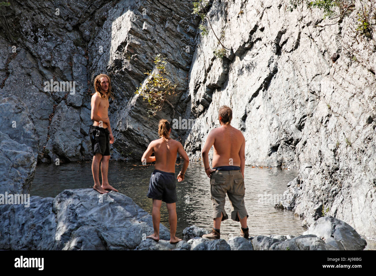 People Climbing Up To a high Mountain Vathres Rock Pool And Waterfall ...