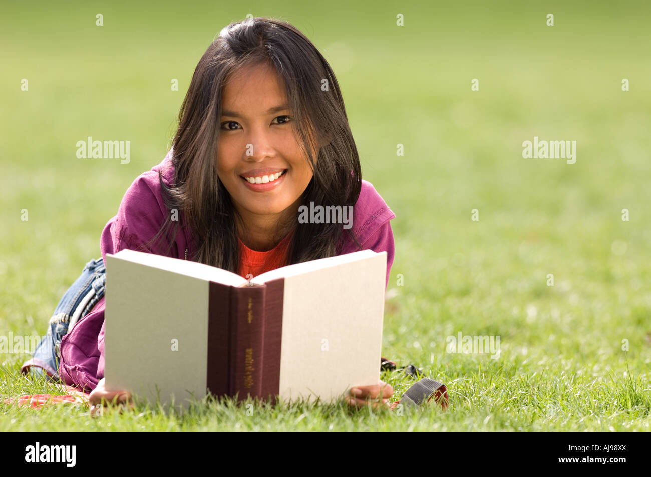 Woman reading a book Stock Photo - Alamy